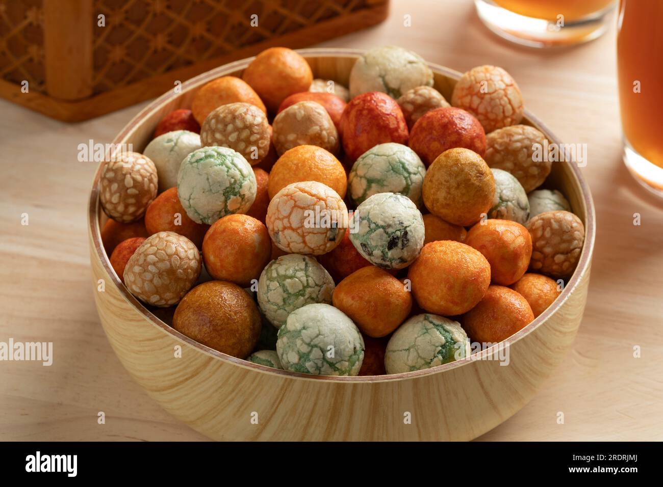 Bowl with Japanese mixed coated peanuts close up on the table for snack ...