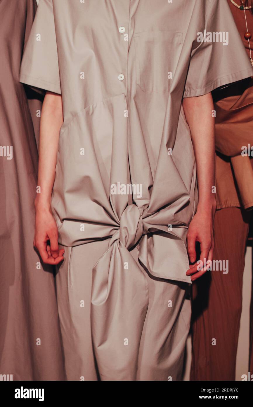 Brown grey cotton costume on female body. Fashion fancy details. Trendy ...