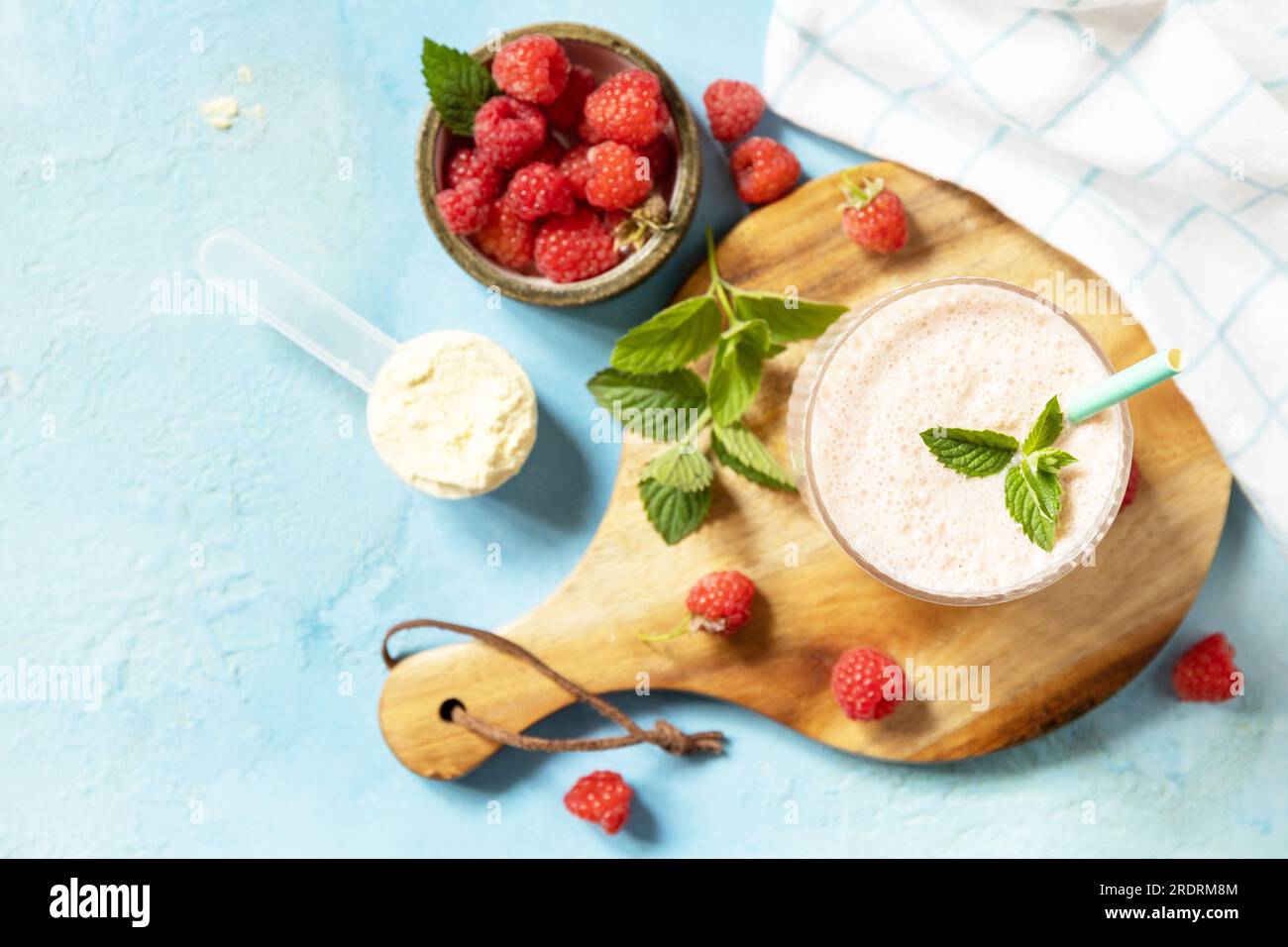 Protein shake with fresh berries. Fresh milk, raspberries drink on ...