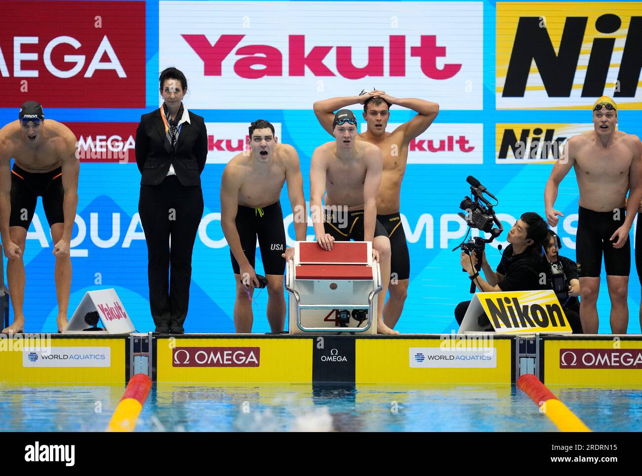 United States team reacts during Men 4 x 100 meter freestyle relay ...