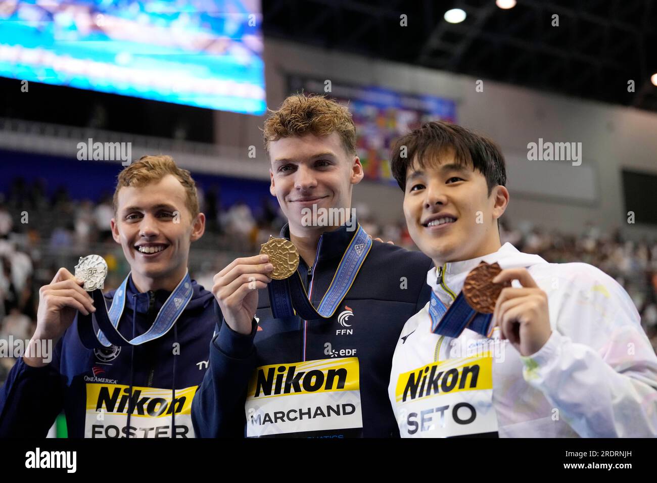 Gold medallist Leon Marchand of France, center, is with by silver ...