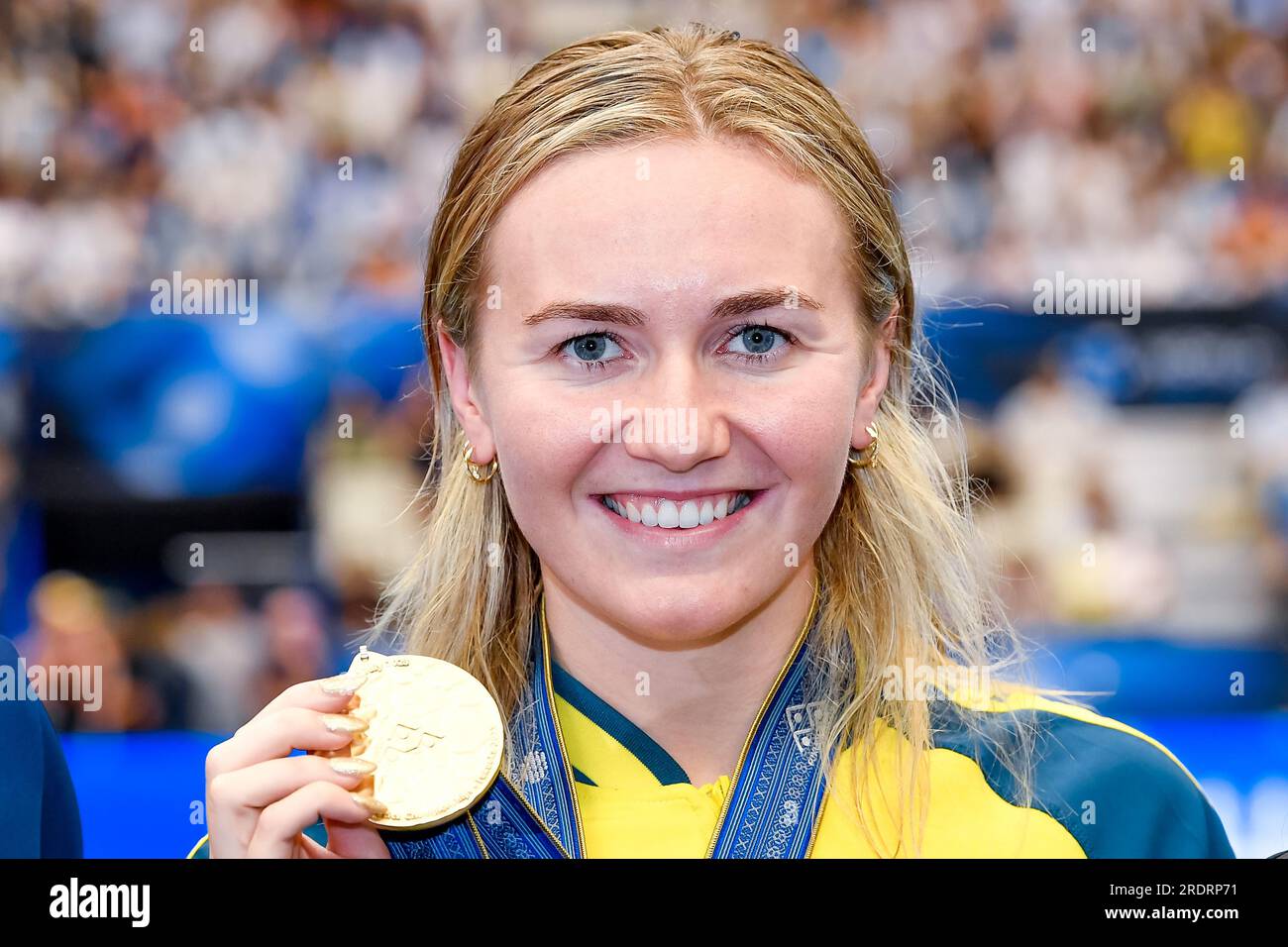Fukuoka, Japan. 23rd July, 2023. Ariarne Titmus of Australia shows the gold medal with a new ...