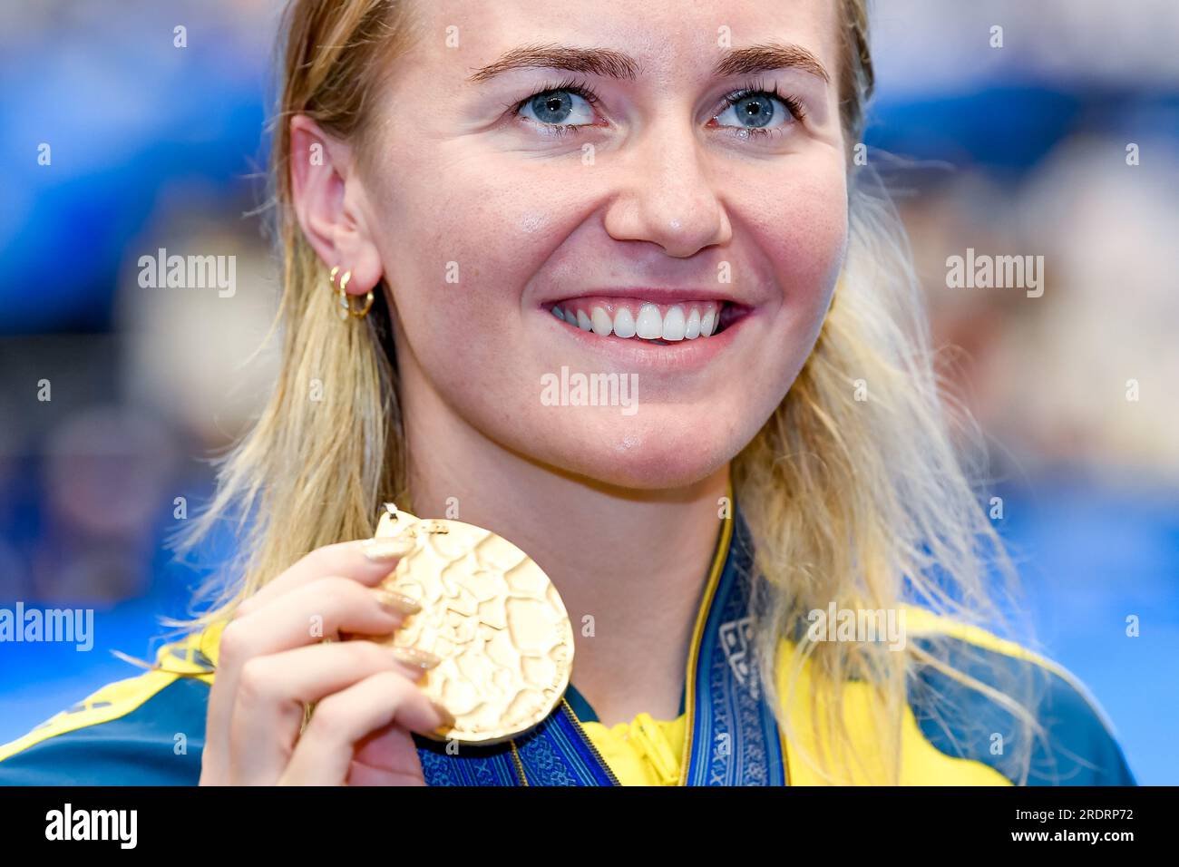 Fukuoka, Japan. 23rd July, 2023. Ariarne Titmus of Australia shows the gold medal with a new ...