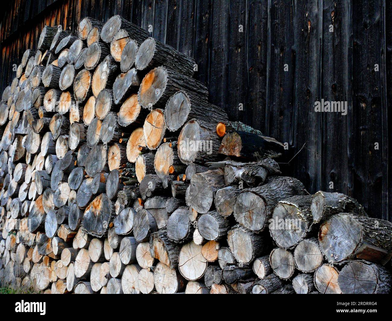 Firewood store, unsplit Stock Photo - Alamy