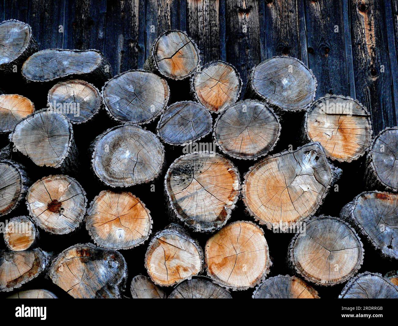 Firewood store, unsplit Stock Photo - Alamy