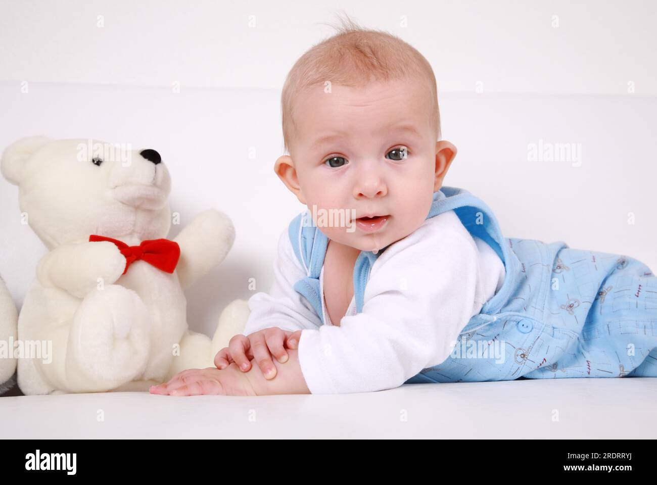 Baby with teddy bear Stock Photo - Alamy