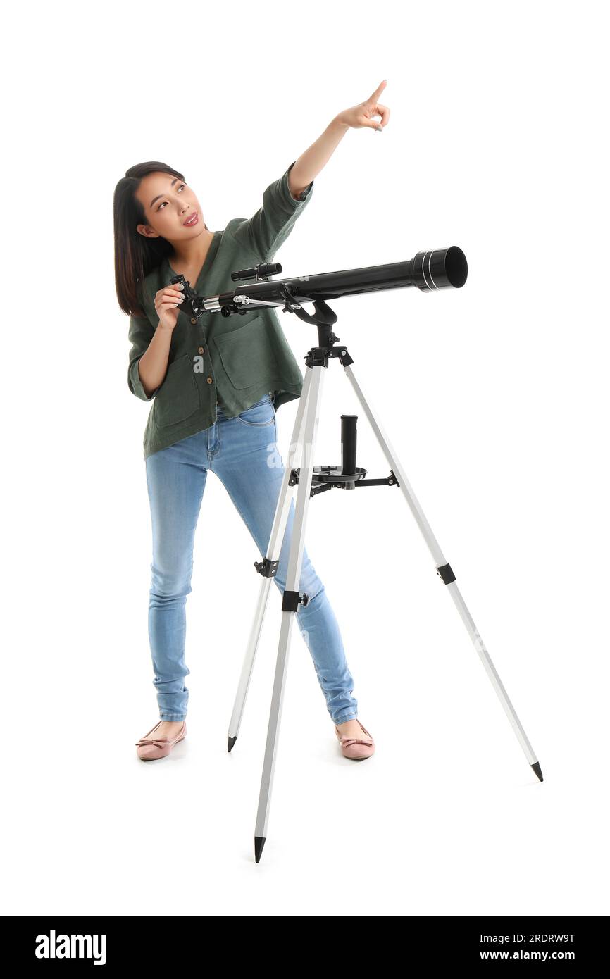 Young Asian woman with telescope pointing at something on white ...