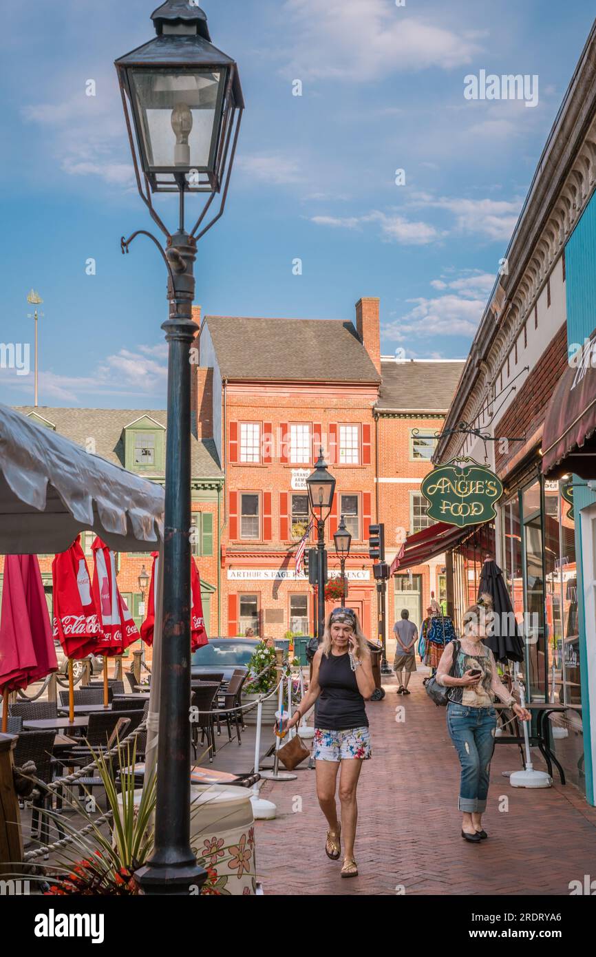 Newburyport, MA, US-July 13, 2023: Street scene in small town downtown with 19th century brick ...