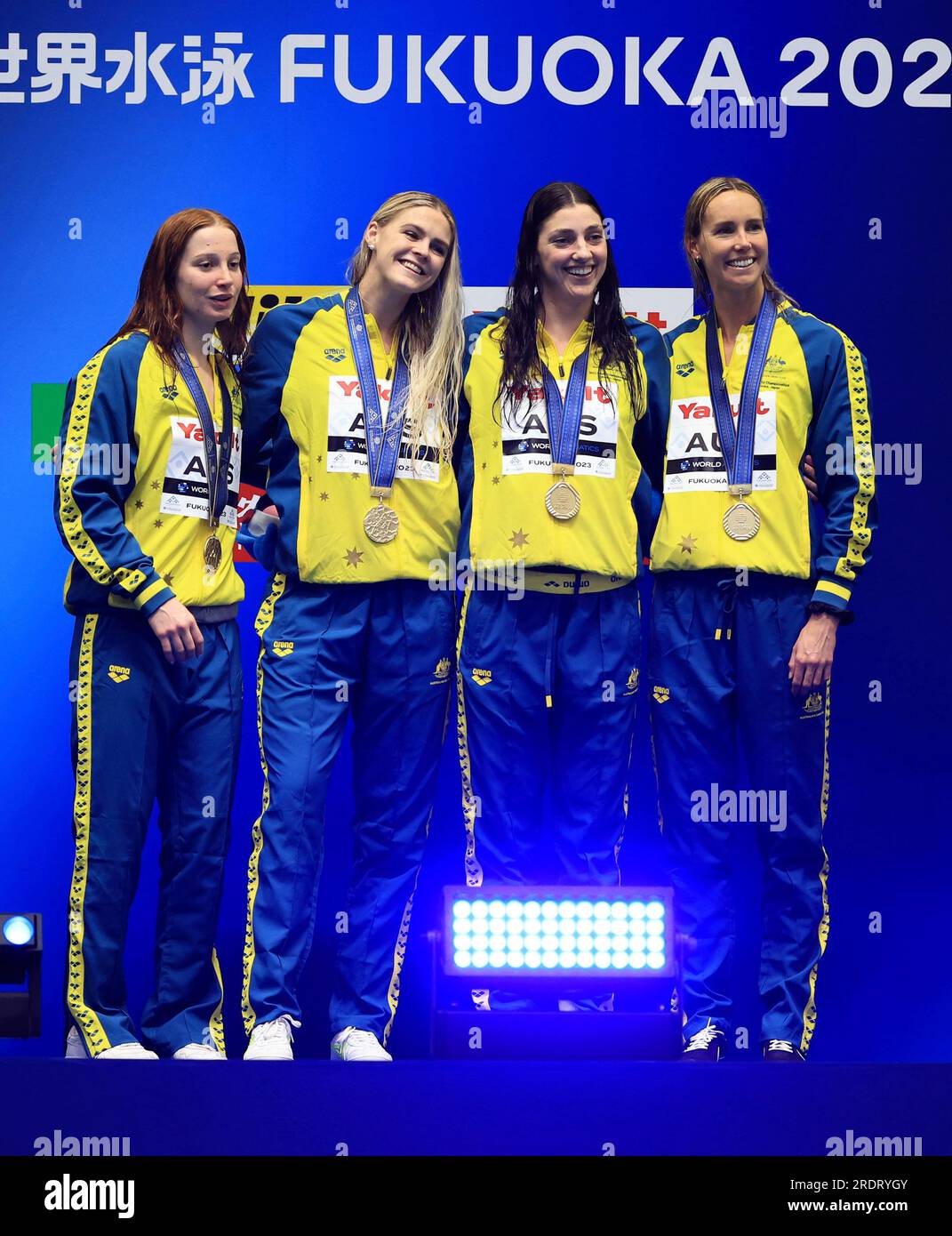 Members of Australia celebrate during an award ceremony of women's 4 x ...