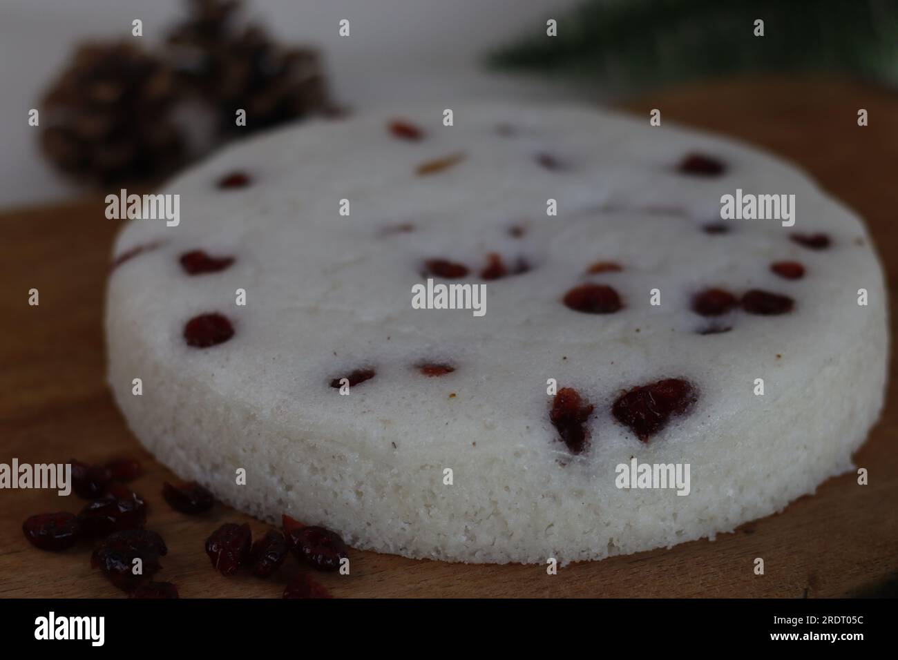 Vattayappam. Steamed spongy rice cake topped with dried cranberries. A ...