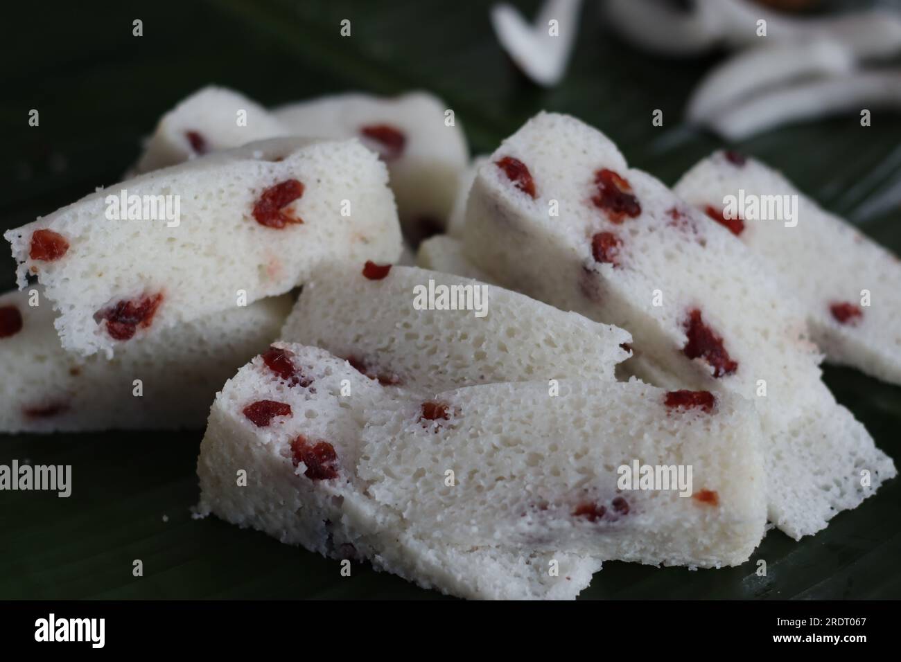 Vattayappam slices. Steamed spongy rice cake topped with dried ...