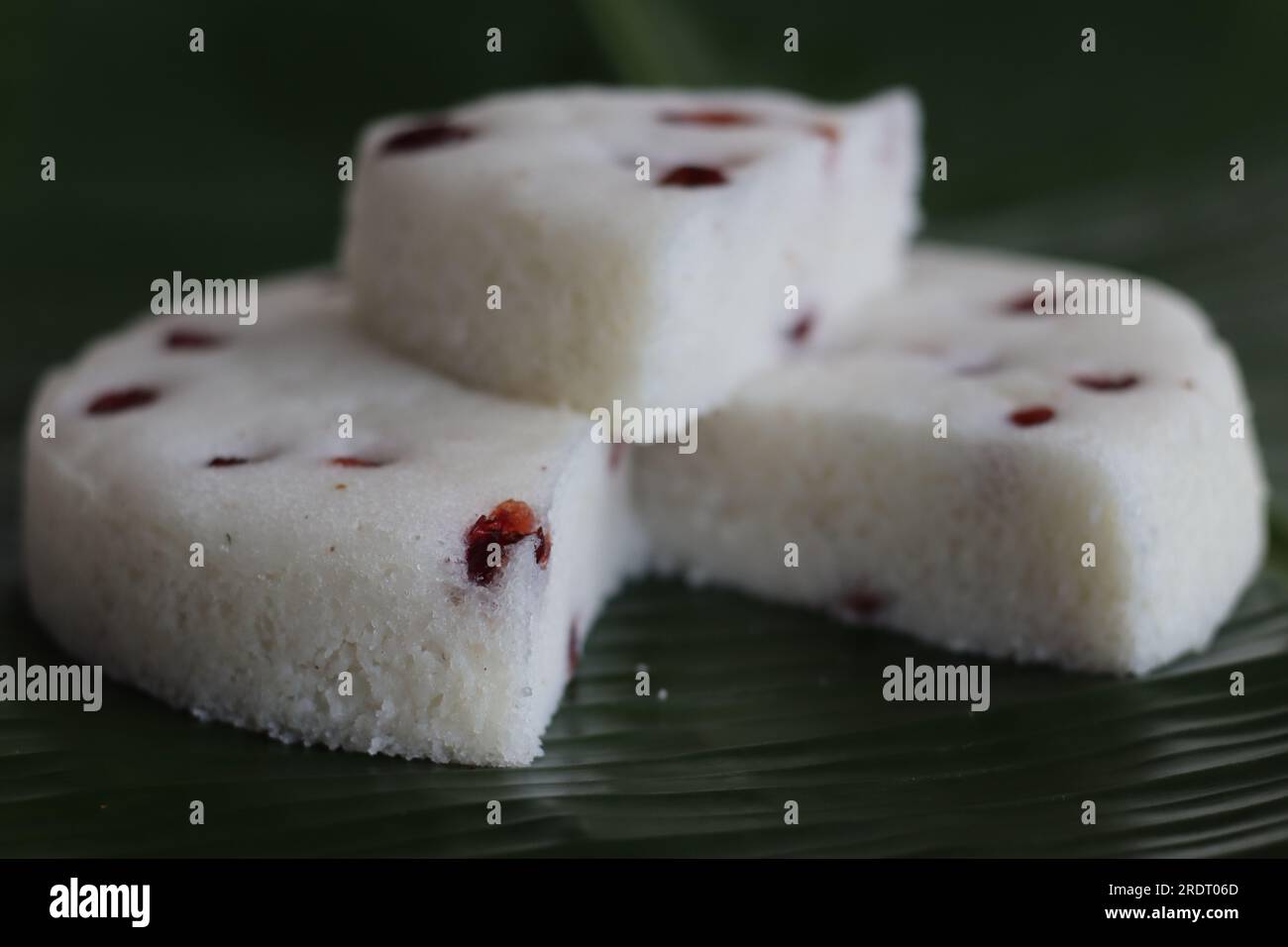 Vattayappam slices. Steamed spongy rice cake topped with dried ...