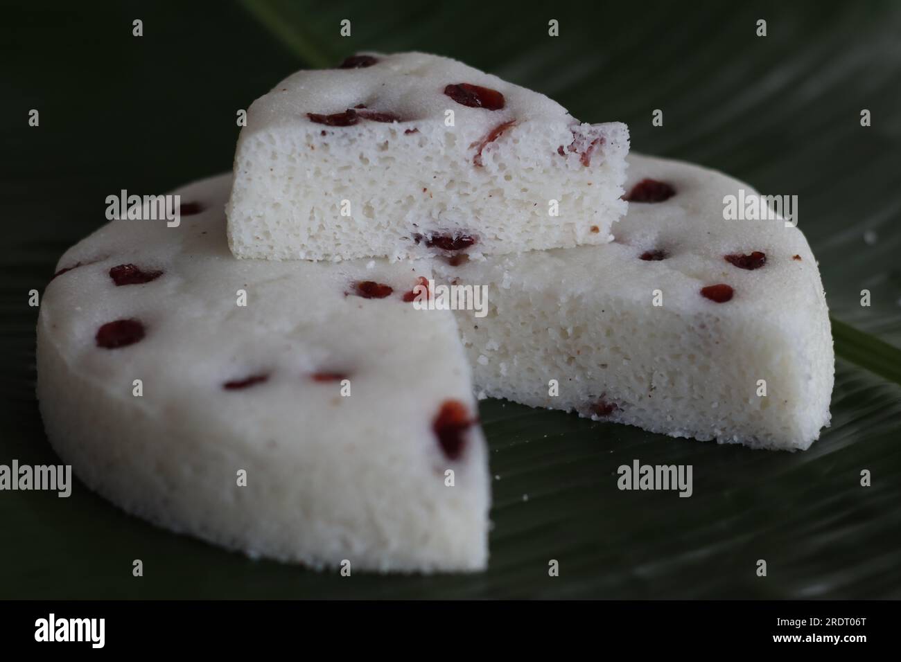Vattayappam slices. Steamed spongy rice cake topped with dried ...