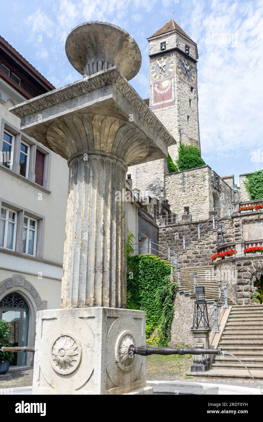 Marble fountain with Rapperswil Castle Clock Tower behind, Hauptplatz ...