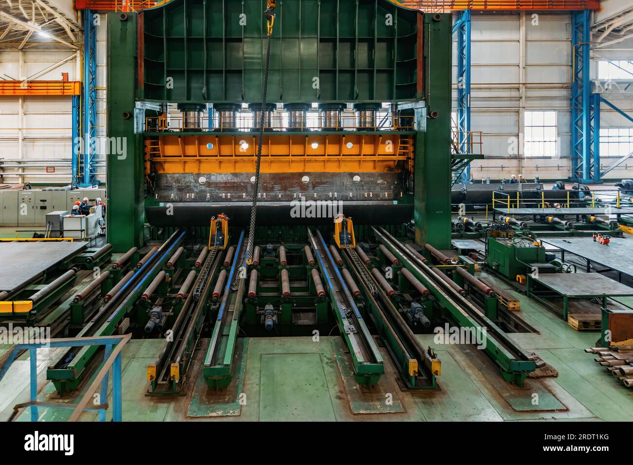 Pipe formation by roll sheet bending machine Stock Photo - Alamy