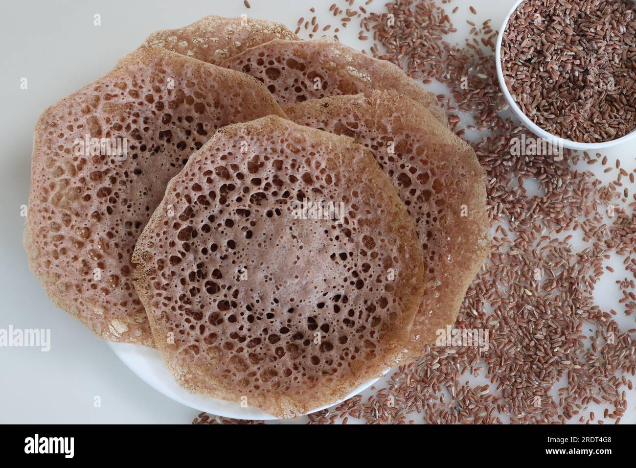 Laced navara rice Crepes or Navara rice appam. Fermented rice pancakes ...