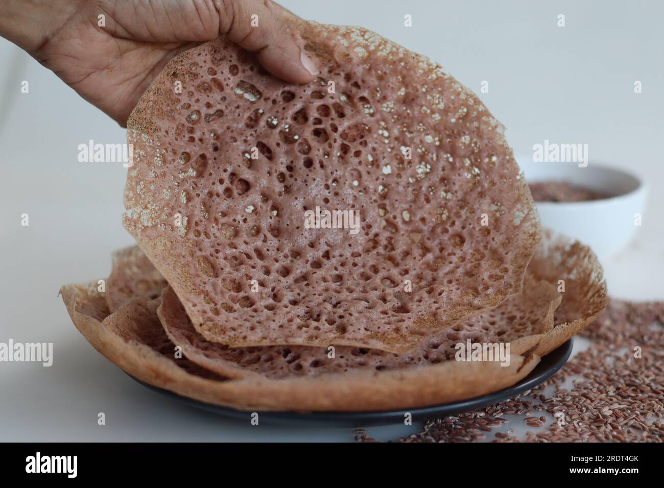 Laced navara rice Crepes or Navara rice appam. Fermented rice pancakes ...