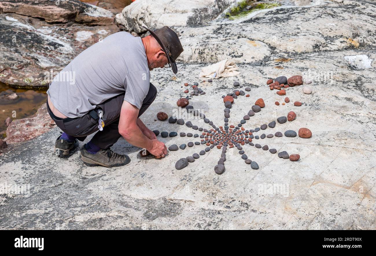 Lawrence Winram creating land art on beach, European Stone Stacking ...