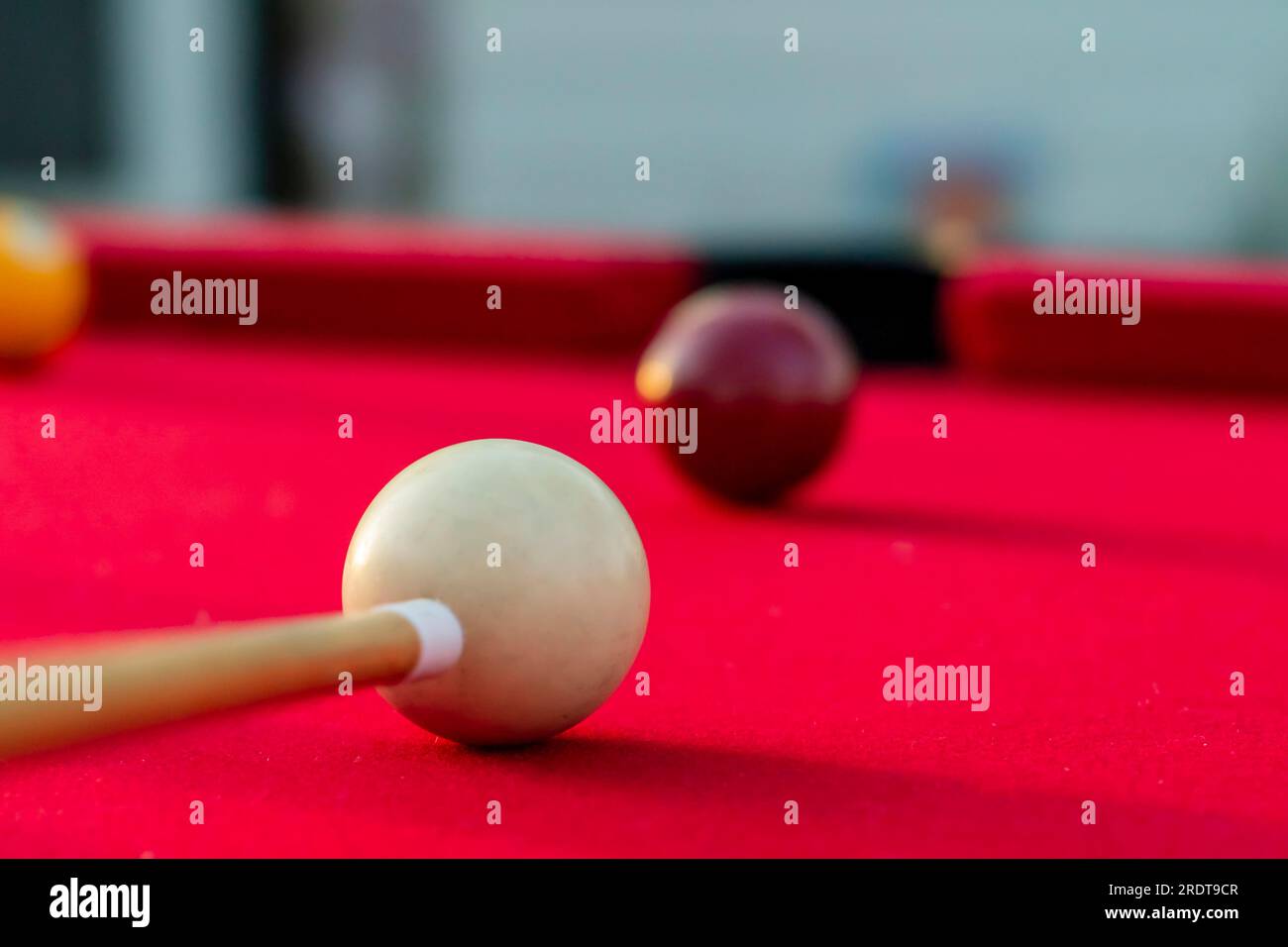 Billiard balls are photographed on fire while sitting outdoors in an ...