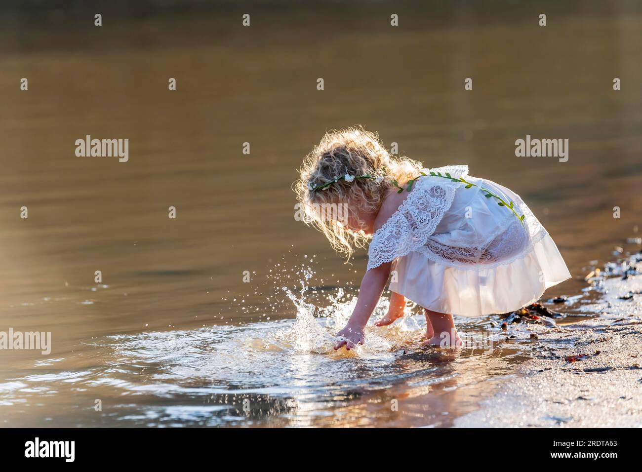 A gorgeous young girl enjoys a spring day outdoors Stock Photo - Alamy