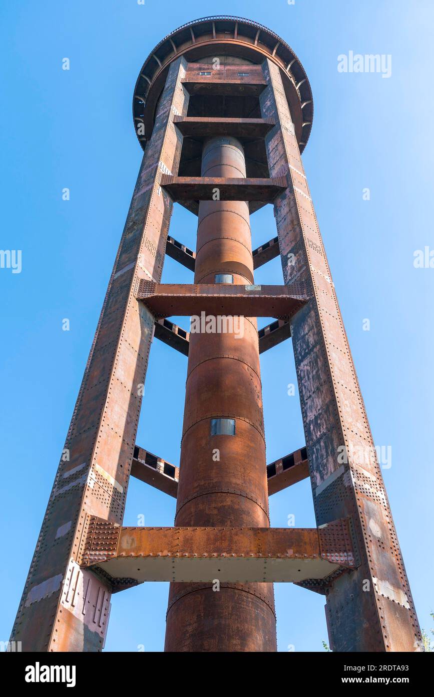 Old rusty water tower and clear blue sky Stock Photo - Alamy