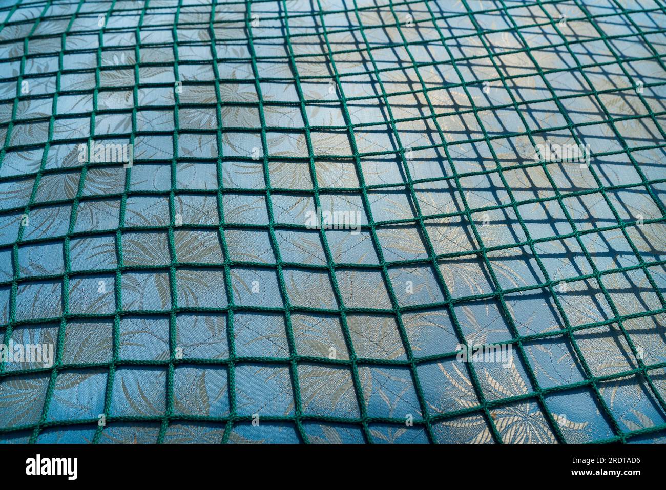Green net over a fabric pattern for backgrounds Stock Photo - Alamy