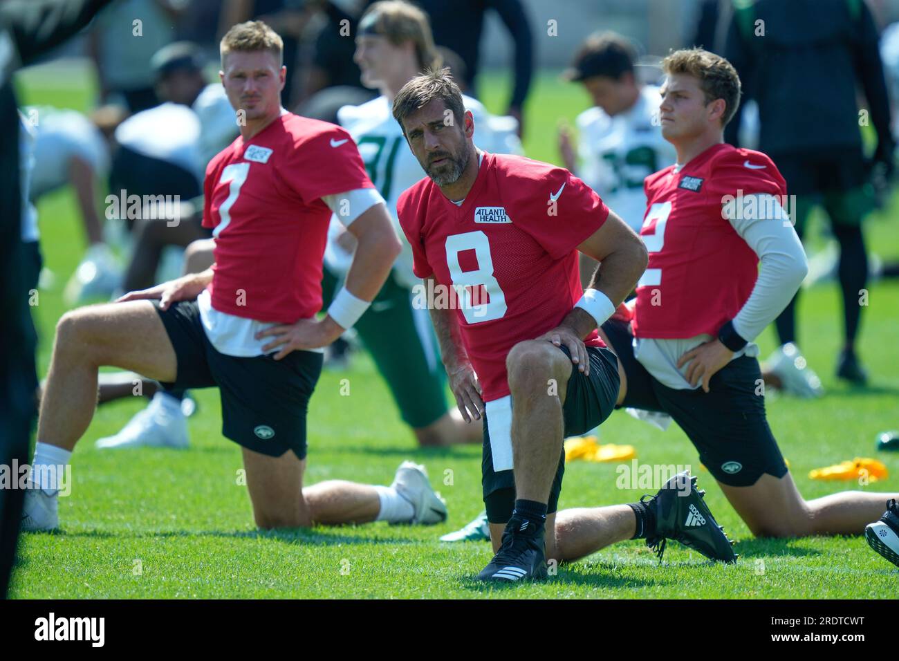 New York Jets quarterback Aaron Rodgers (8) stretches at the NFL ...