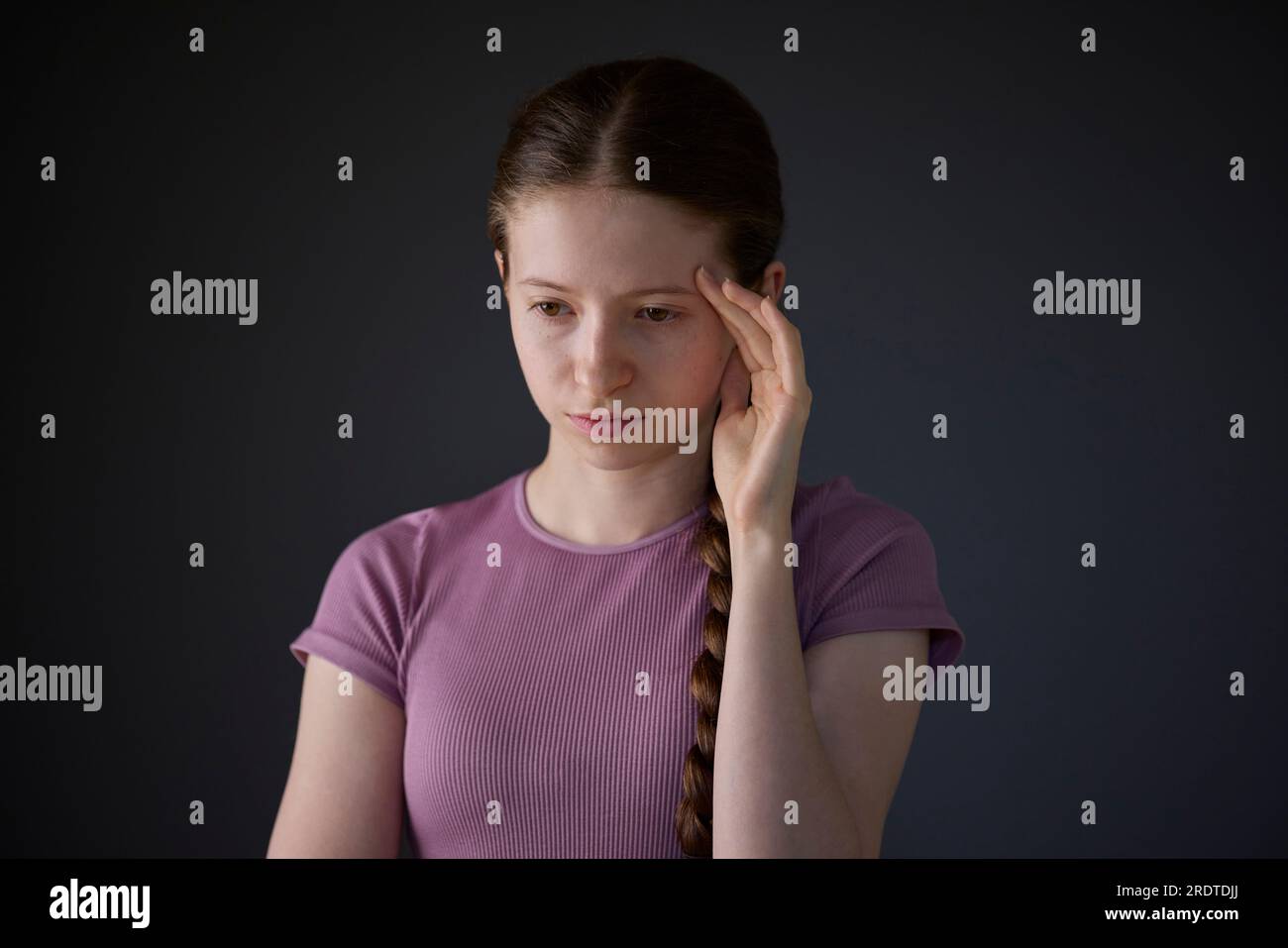Low Key Studio Portrait Of Stressed Teenage Girl Worried About Mental ...