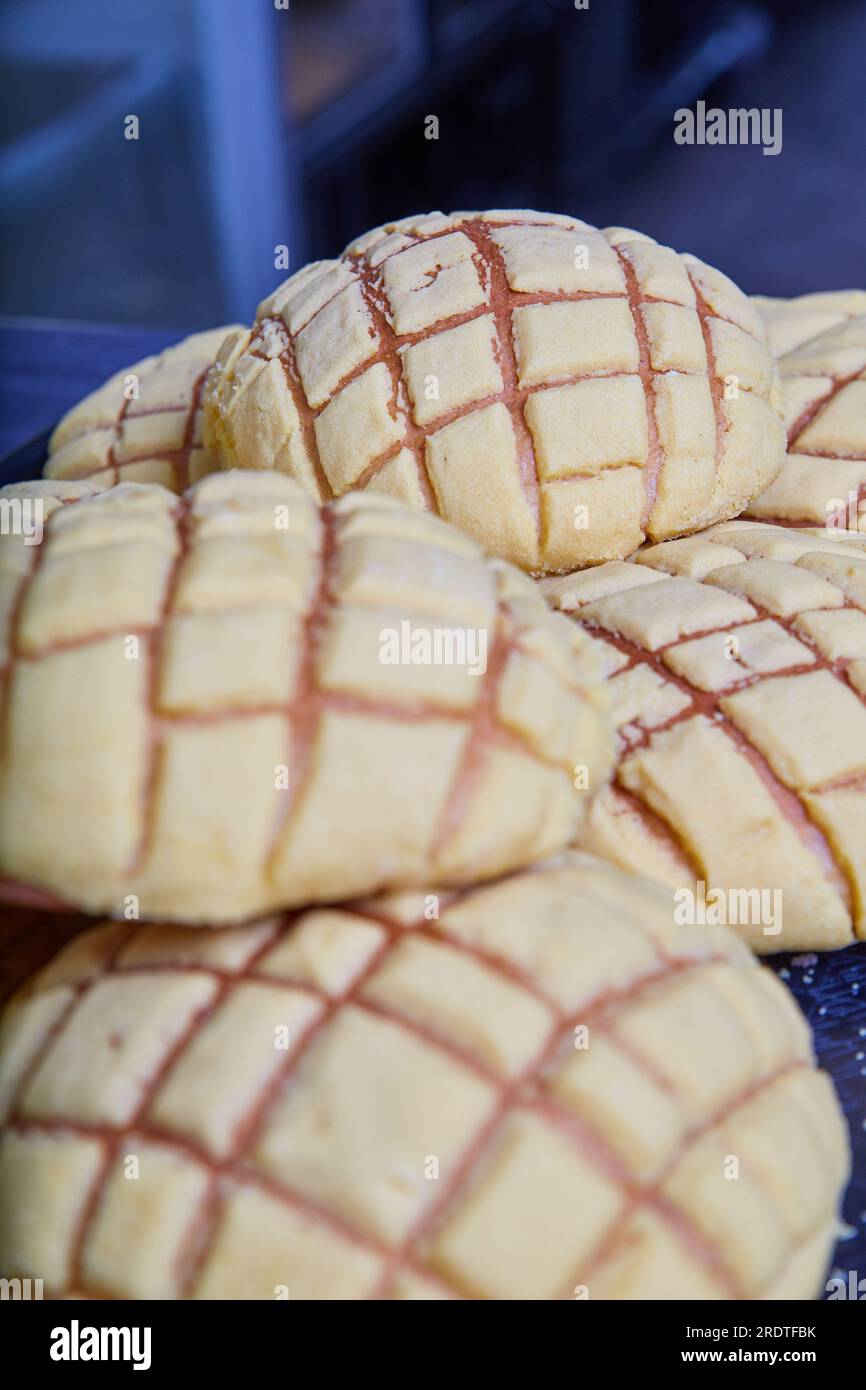 White vanilla frosting on Mexican sweet bread baked good conchas pastry ...