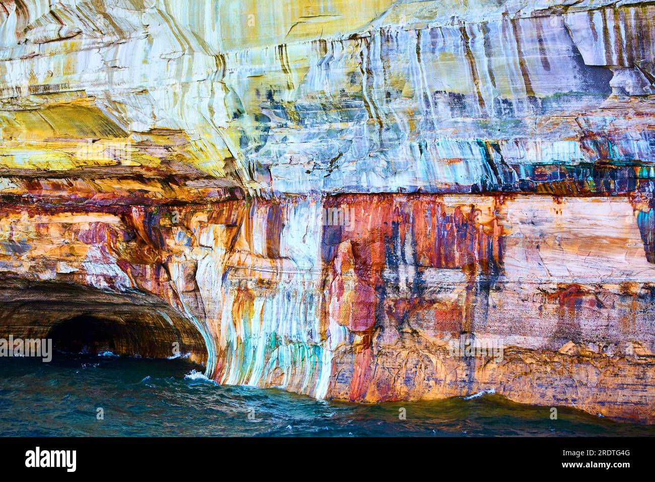 White and yellow streaks in stone plus iron mineral deposits with ...