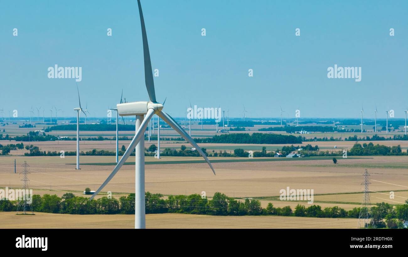 Wind farm in farmland with close up of wind turbines aerial Stock Photo ...