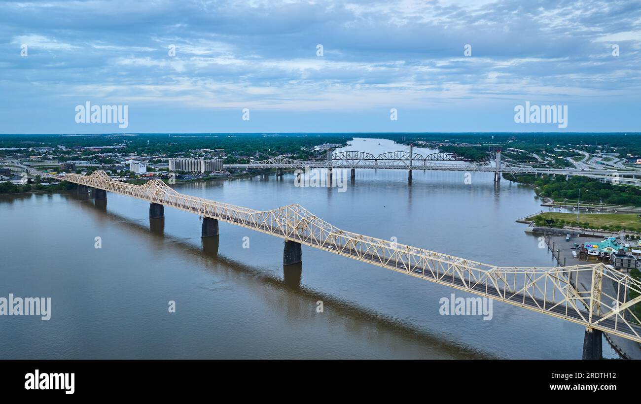 White gold truss bridge stretching across large river Ohio River aerial ...