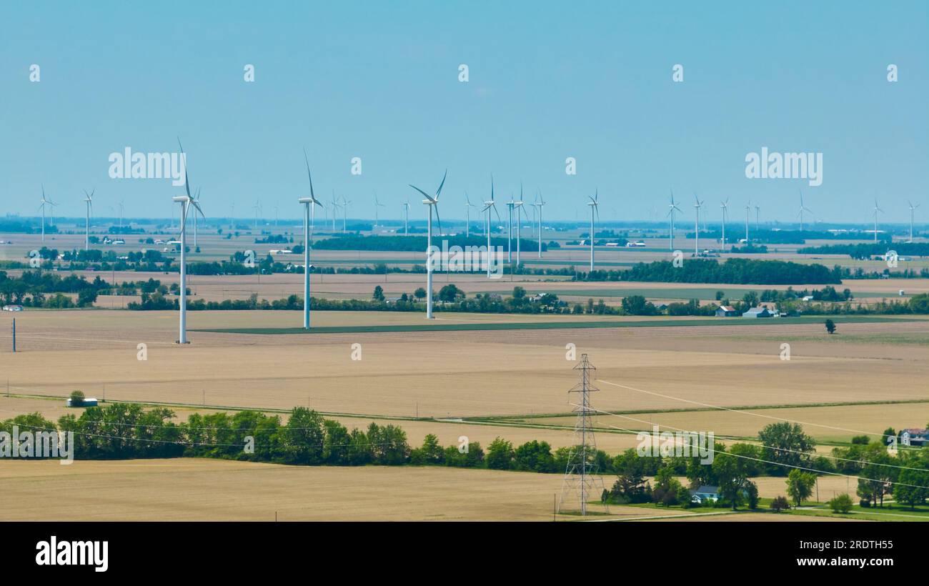 Wind farm aerial with power lines on summer day Stock Photo - Alamy