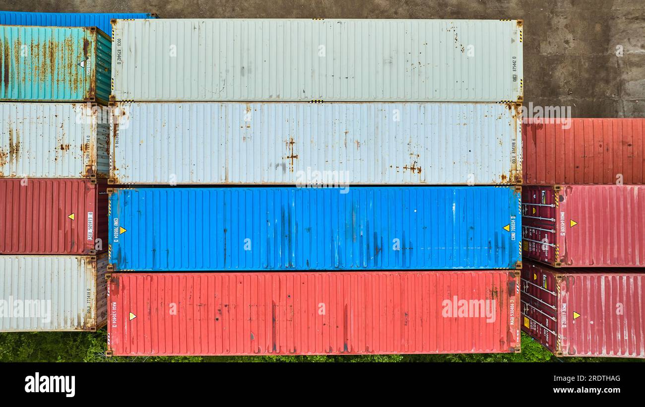 White, blue, and pink pastel colored shipping containers in shipping ...