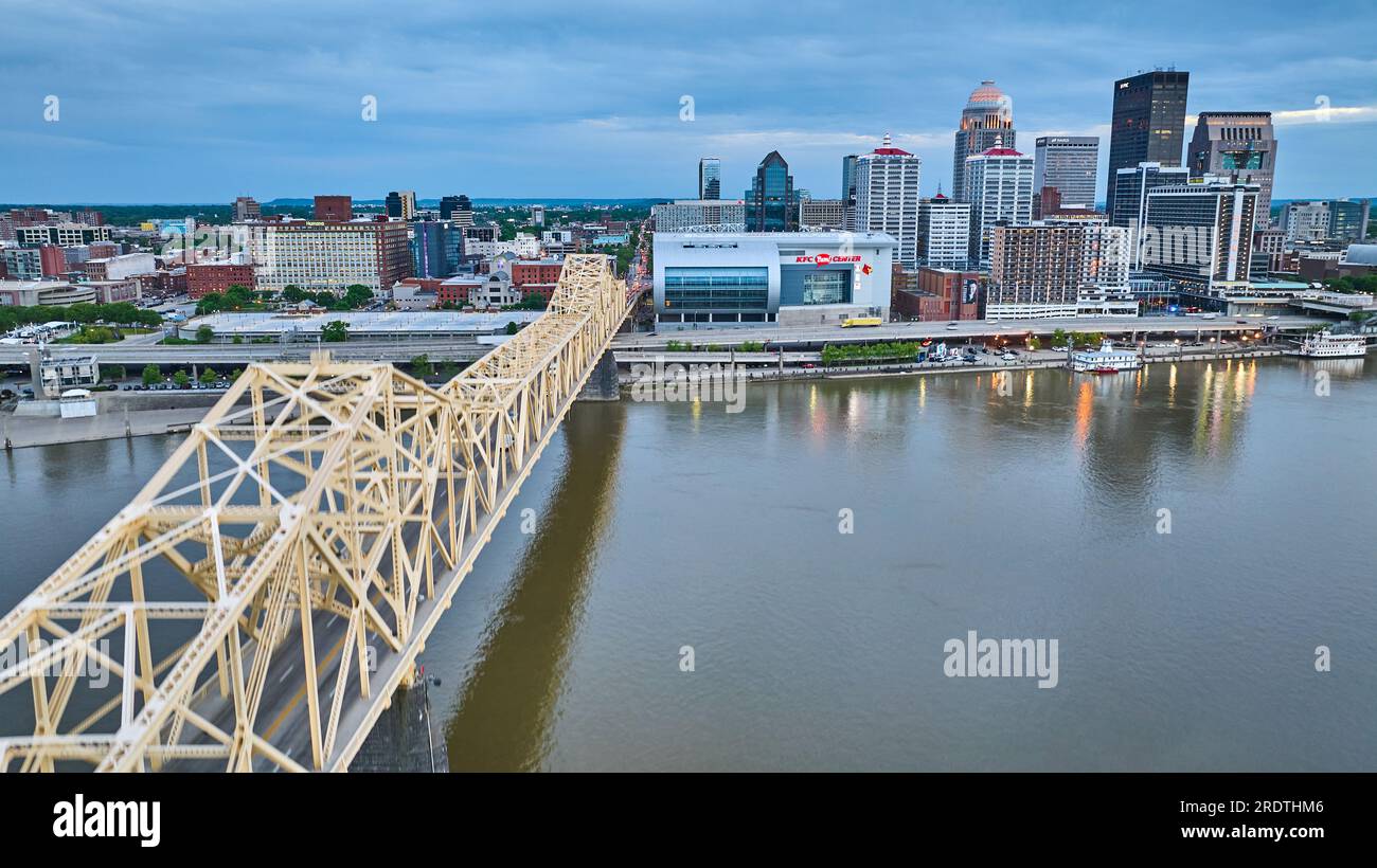 Truss bridge stretching toward downtown Louisville Kentucky blue sunset ...
