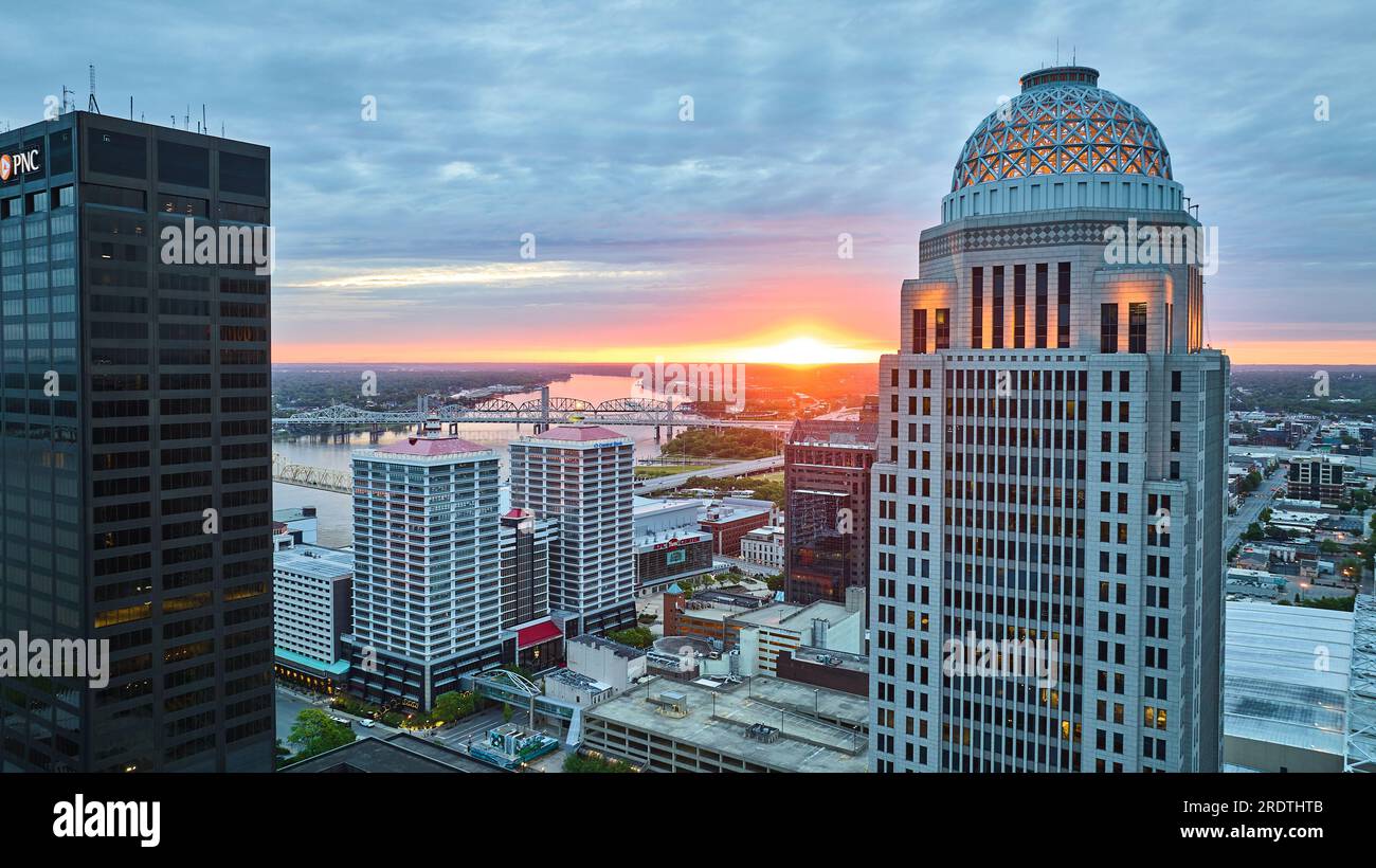 Sun poking behind main downtown Louisville Kentucky building aerial ...