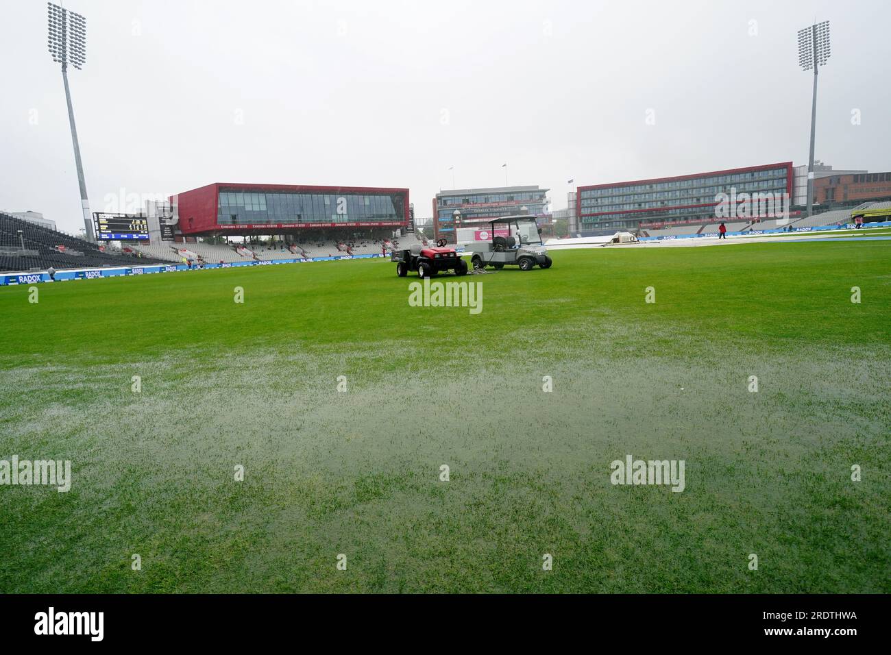 Rain water gathers around the edge of the pitch on day five of the ...