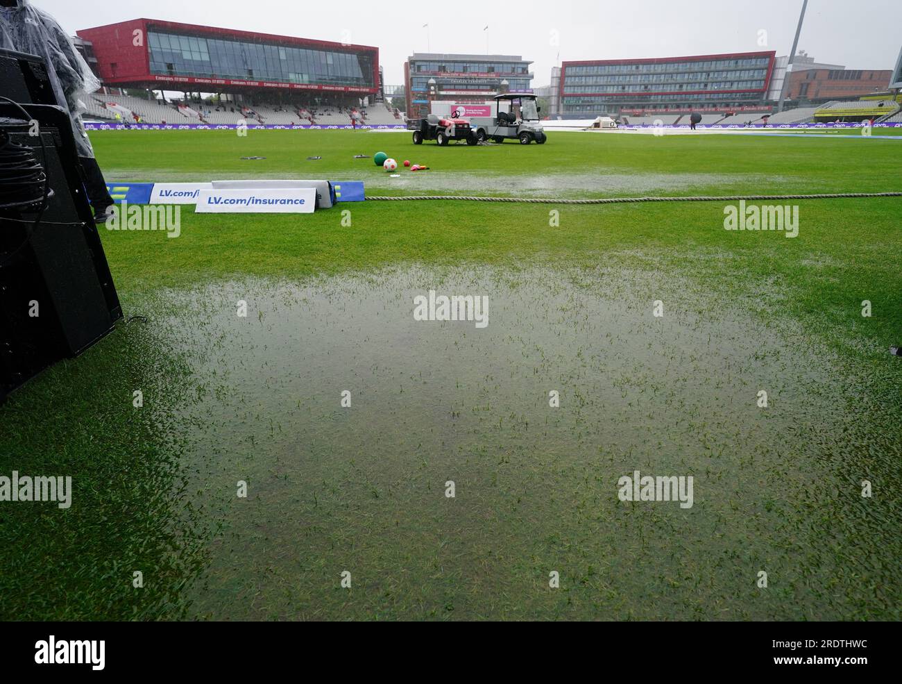 Rain water gathers around the edge of the pitch on day five of the ...