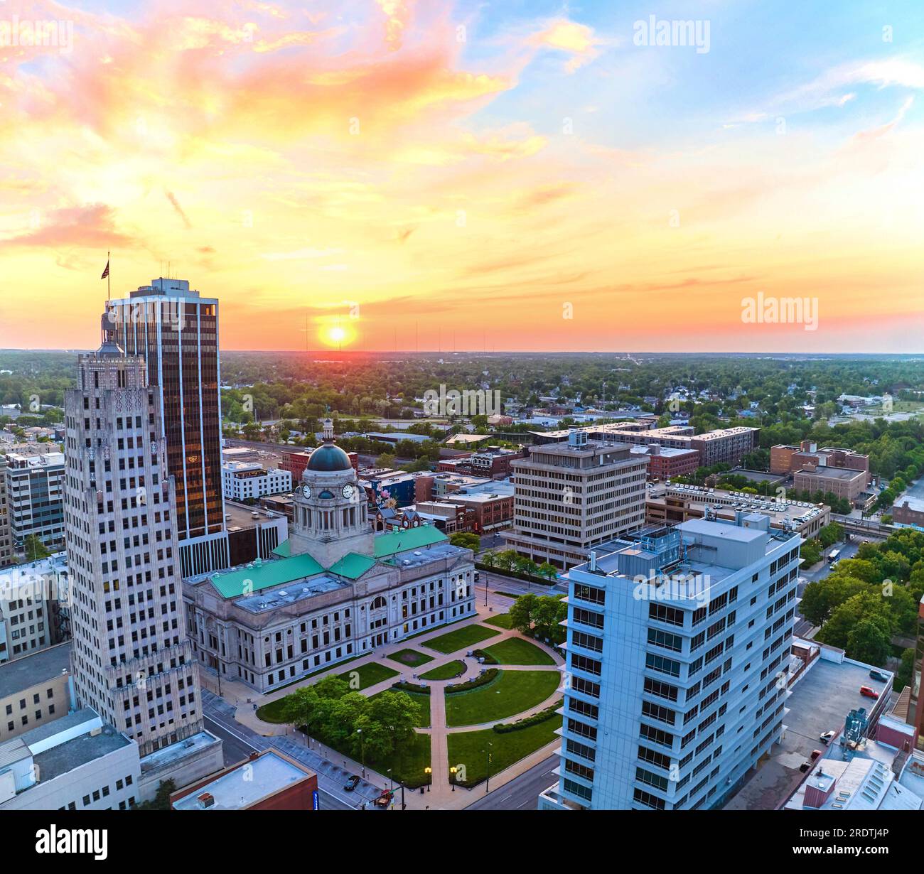 Pink and gold sunrise over downtown Fort Wayne with courthouse panorama ...