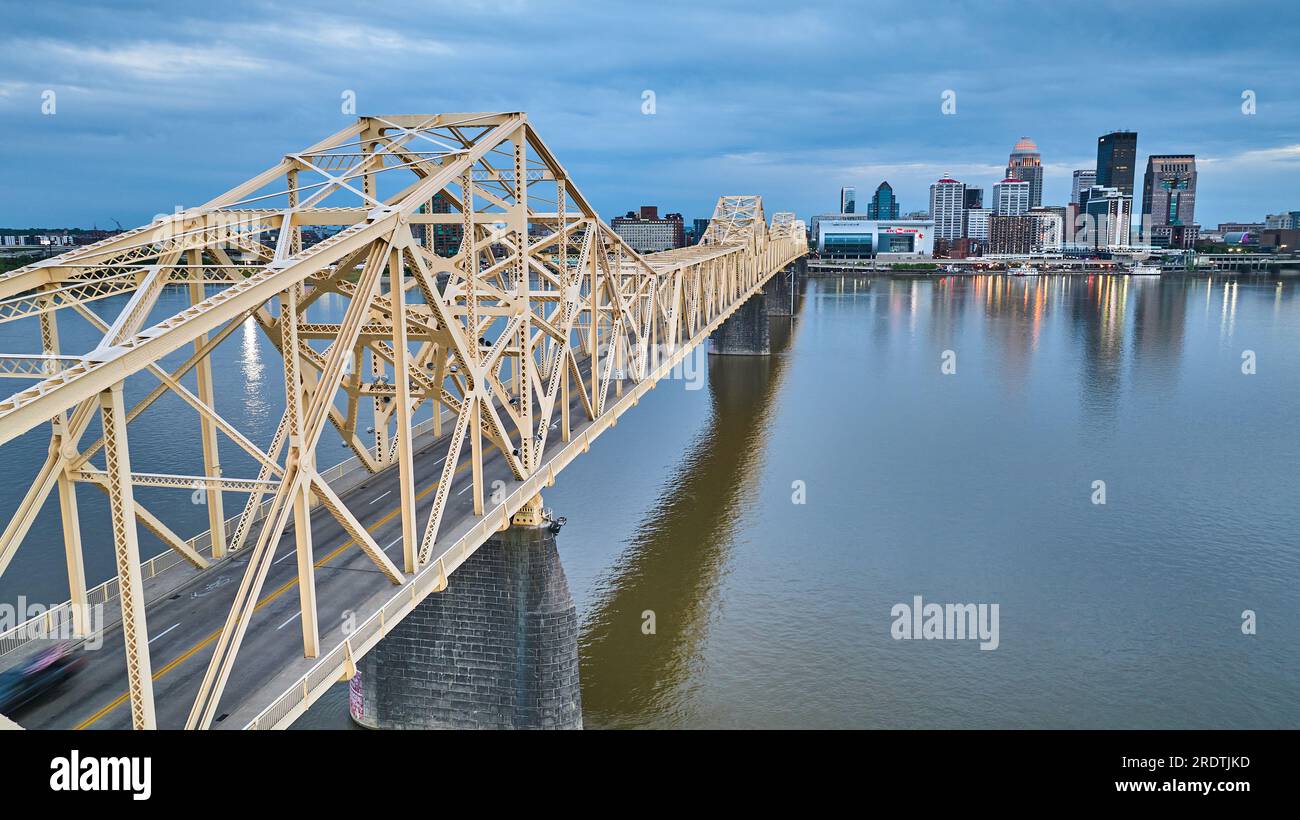 Rose gold truss bridge over Ohio River waterway leading to heart of ...