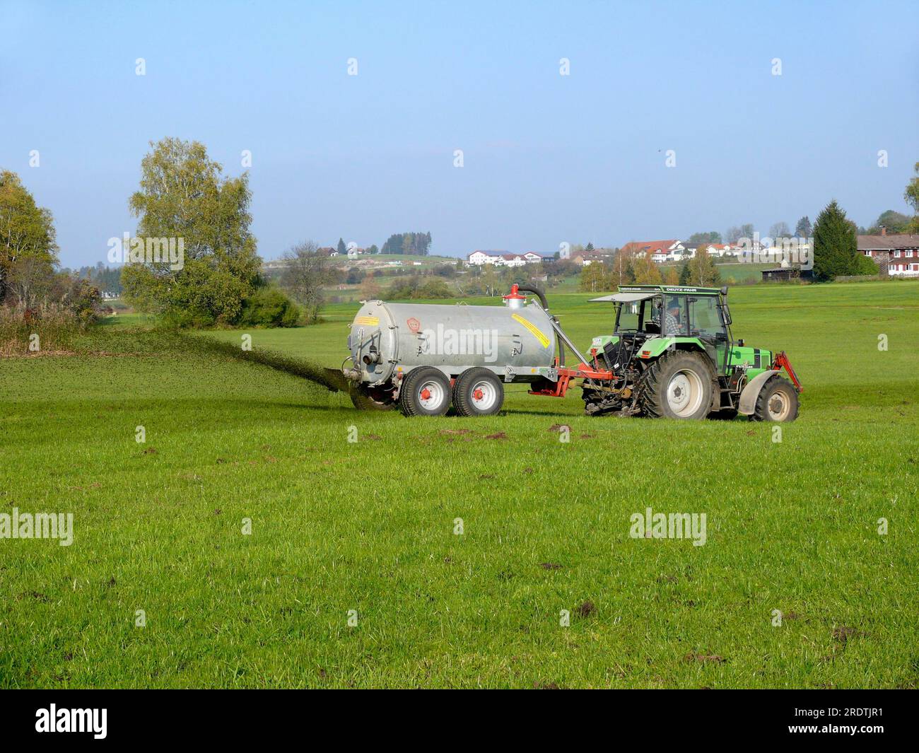 Tractor and slurry tanker, slurry tanker Stock Photo - Alamy