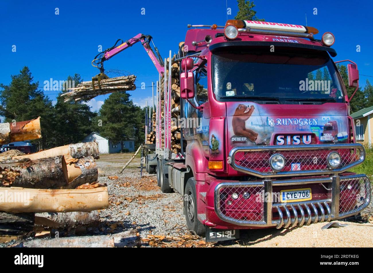 Painted truck loaded with logs, loading of wood, Pello, Lapland ...