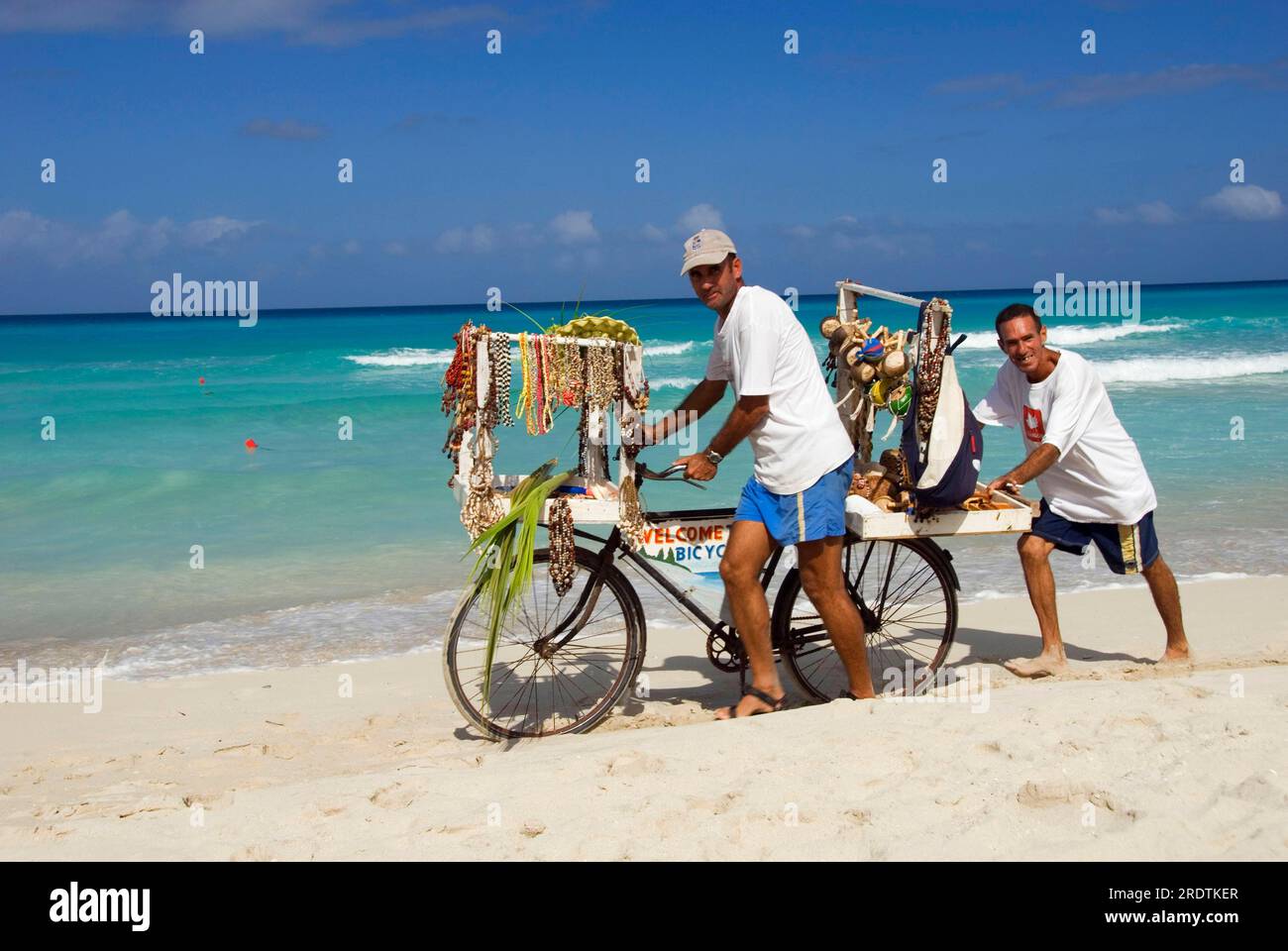 Beach vendor with bicycle, Varadero, Cuba Stock Photo - Alamy
