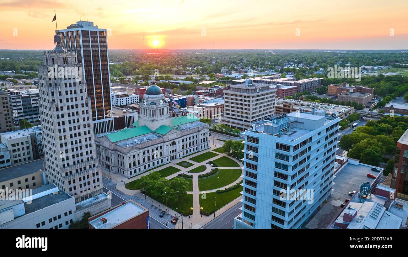 Panorama golden orange sunrise over summertime courthouse in downtown ...