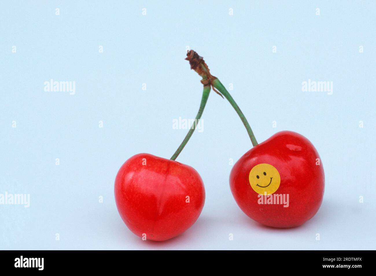 Cherries (Prunus) with smiley face label, sweet cherry Stock Photo - Alamy