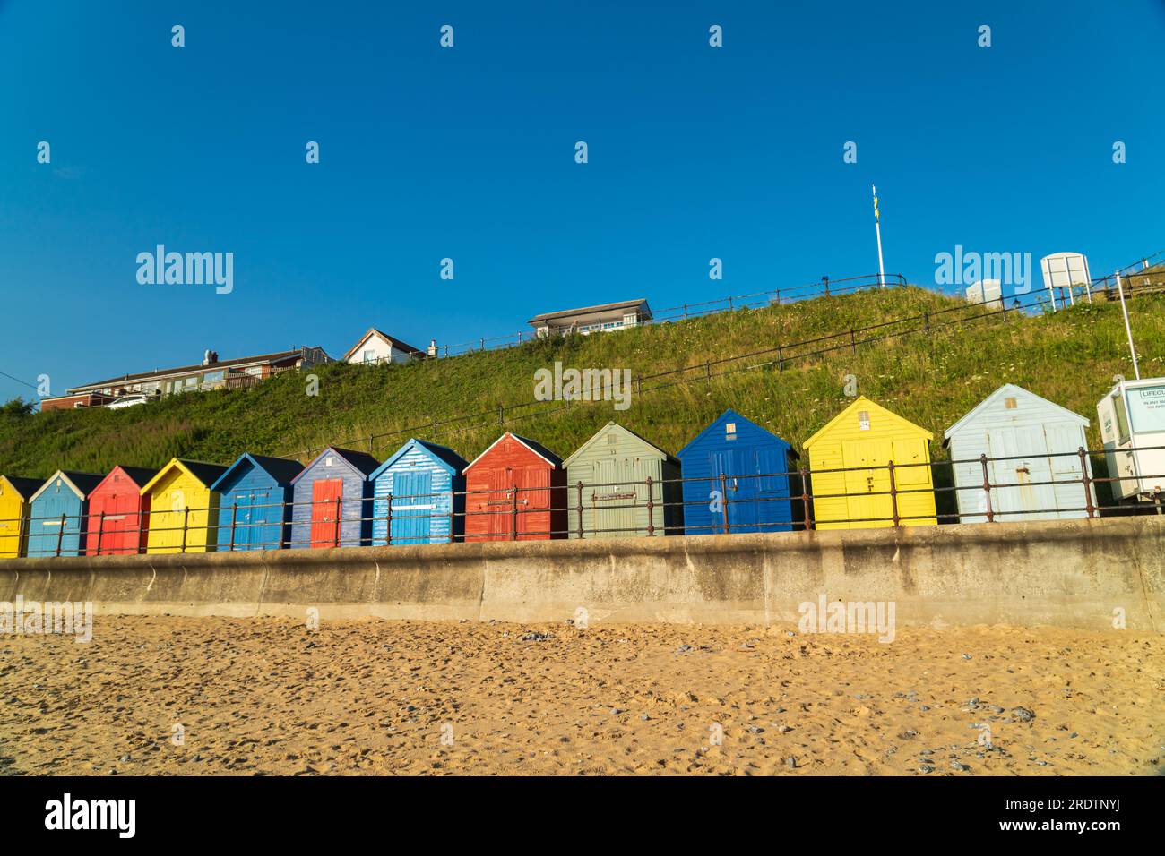 Colourful beach huts on the beach in Mundesley, North Norfolk, UK on a ...