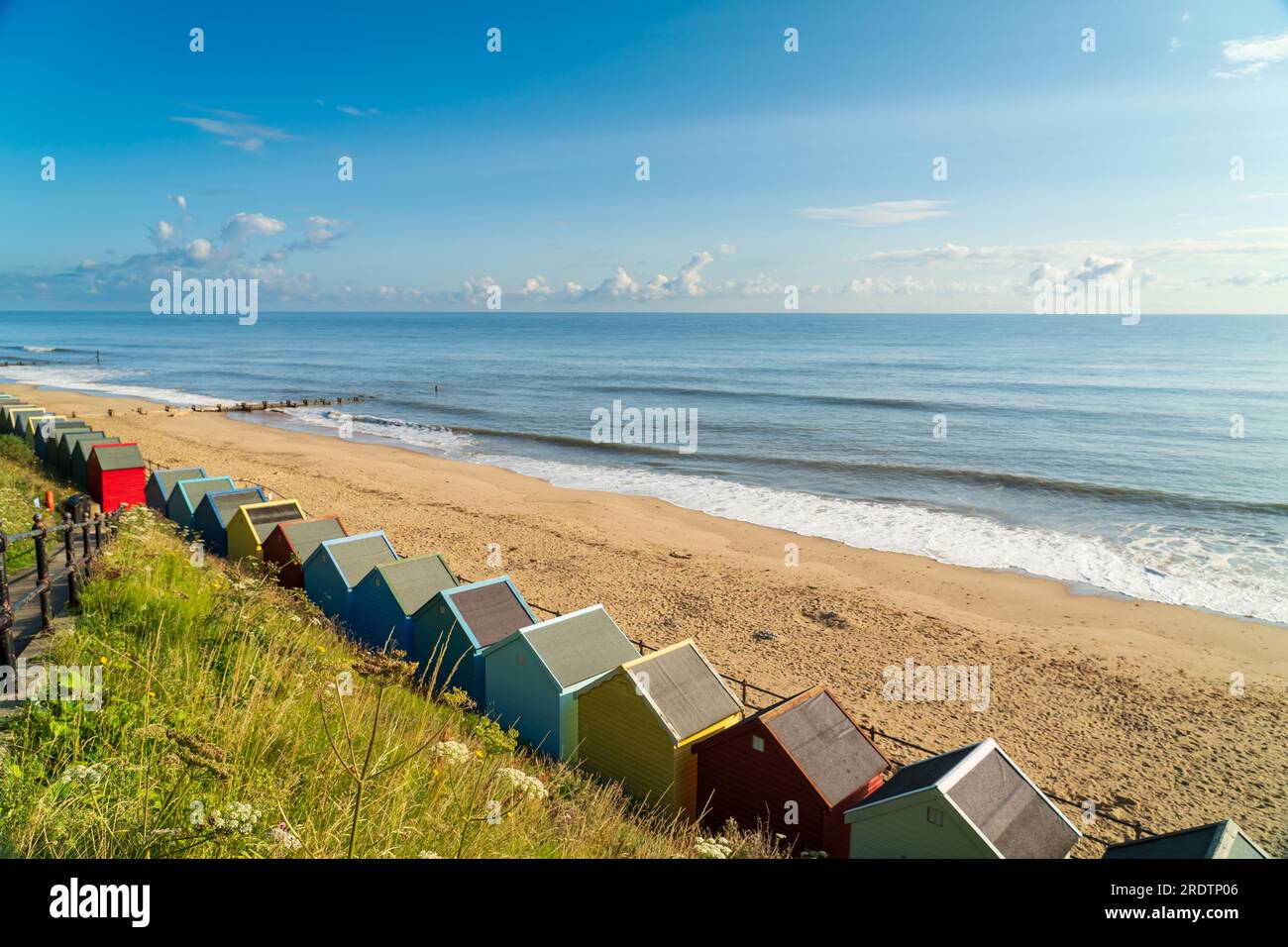 Colourful beach huts on the beach in Mundesley, North Norfolk, UK on a ...