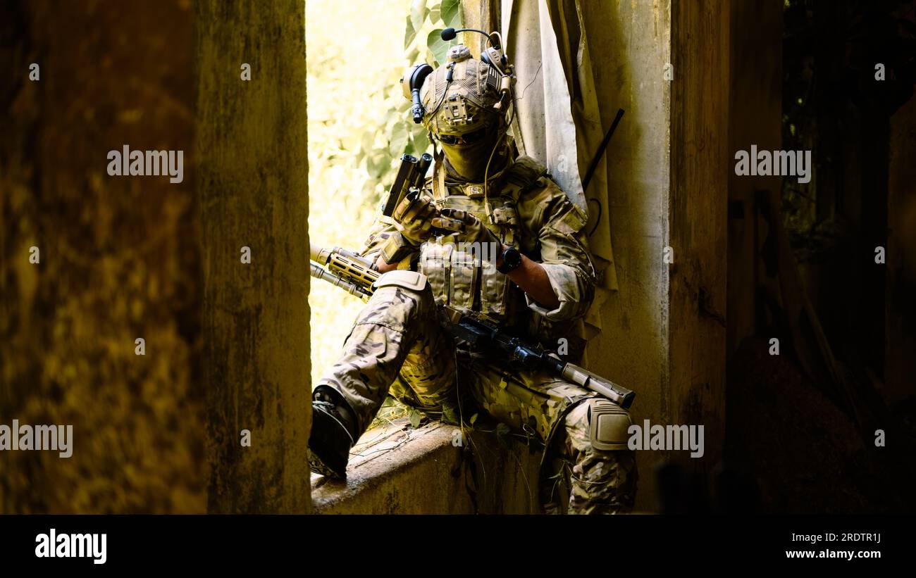 Smart teamwork of soldiers running forward and attacking enemy during ...