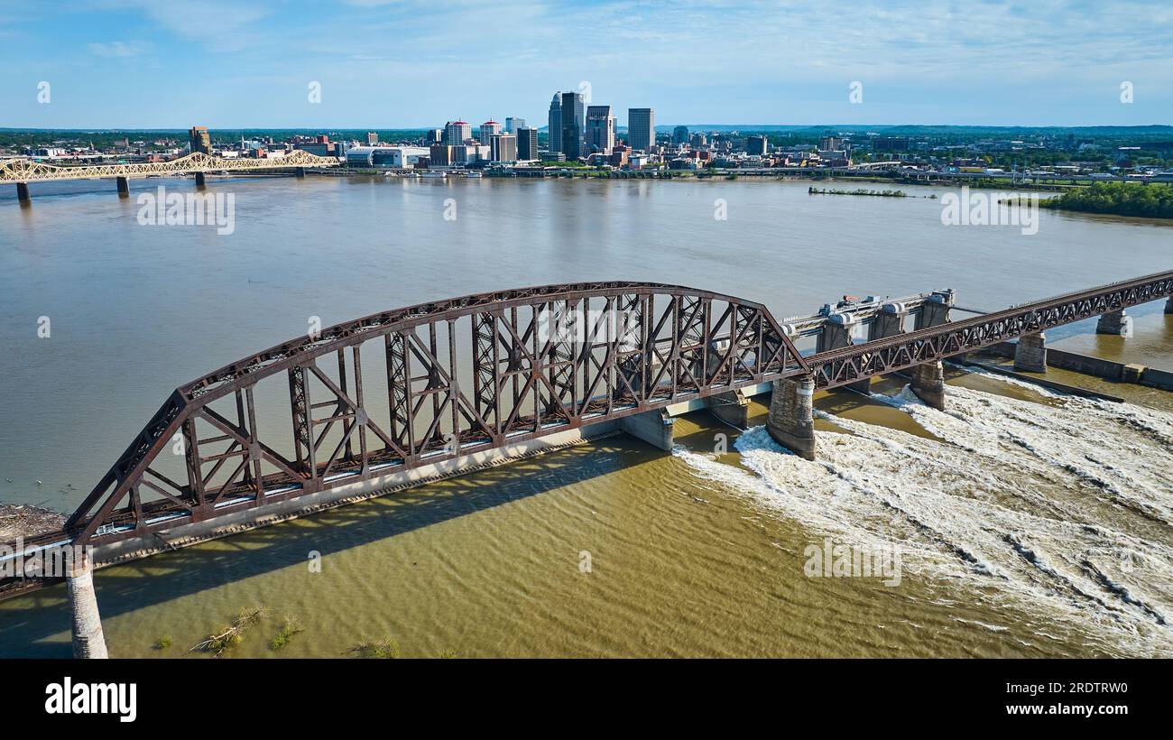 Aerial truss arch bridge over Ohio River rapids from dam Louisville ...