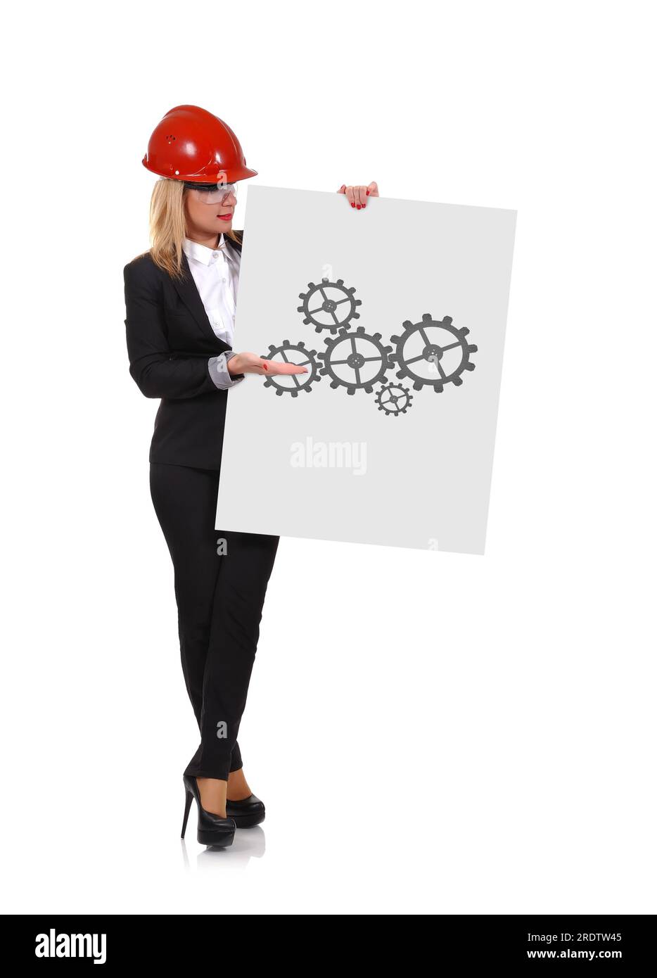 Engineer woman holding poster with drawing gears Stock Photo - Alamy